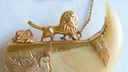 Antique lions claw brooch