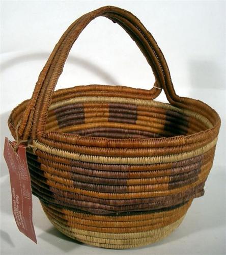 A FINE AUSTRALIAN ABORIGINAL BASKET,of woven poly