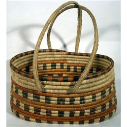 A FINE AUSTRALIAN ABORIGINAL BASKET,of woven poly