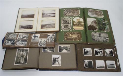 Collection of black and white photograph albums and postcard albums ...