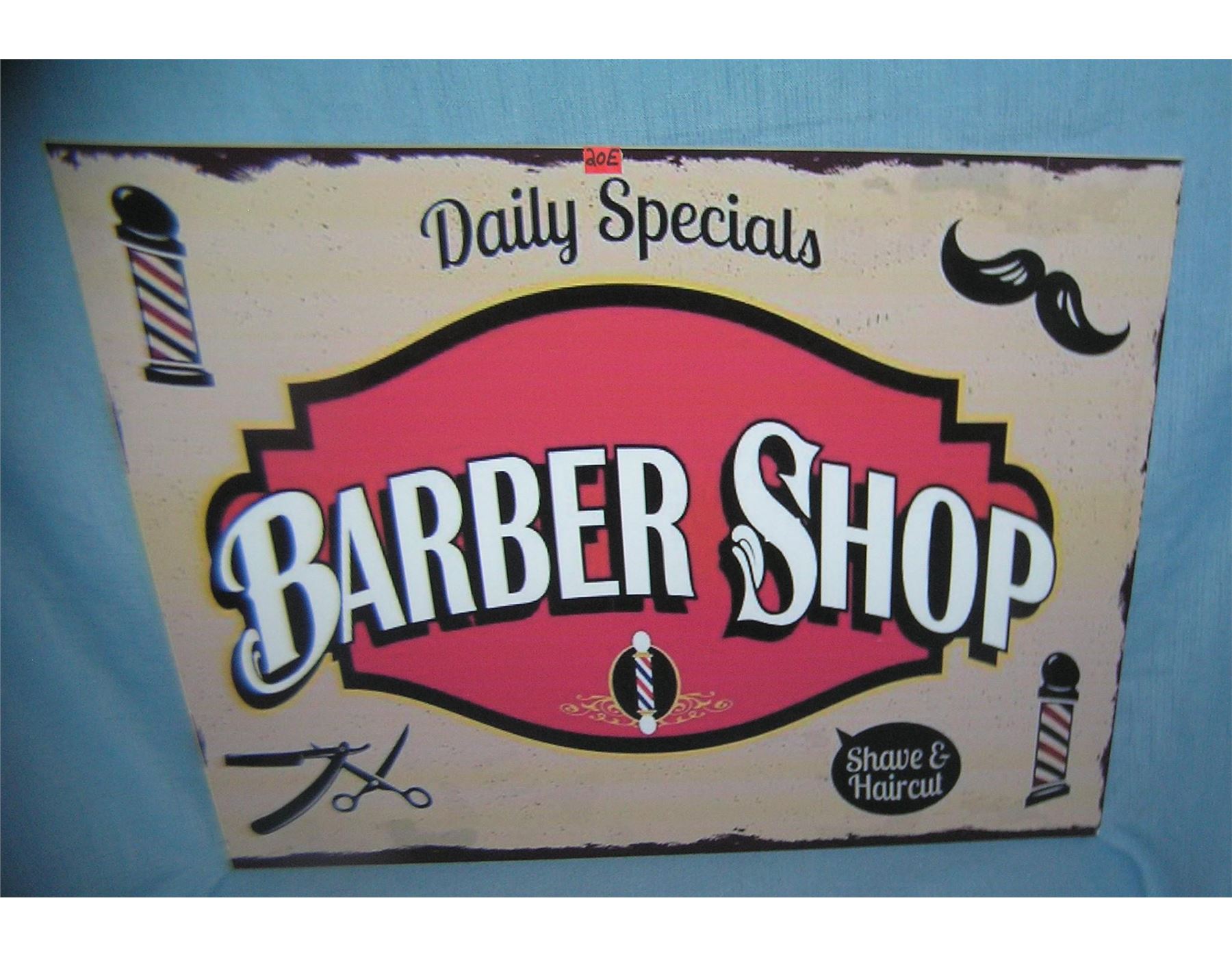 Barber shop shave and haircut advertising sign