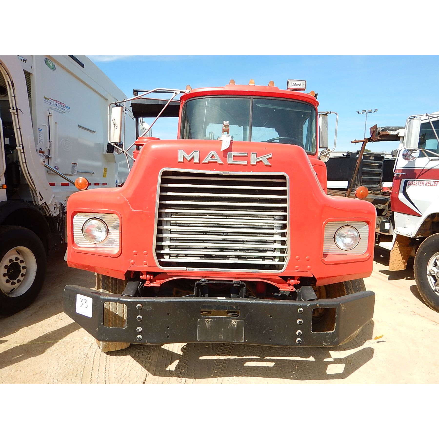 1991 MACK DM690S Roll Off Truck