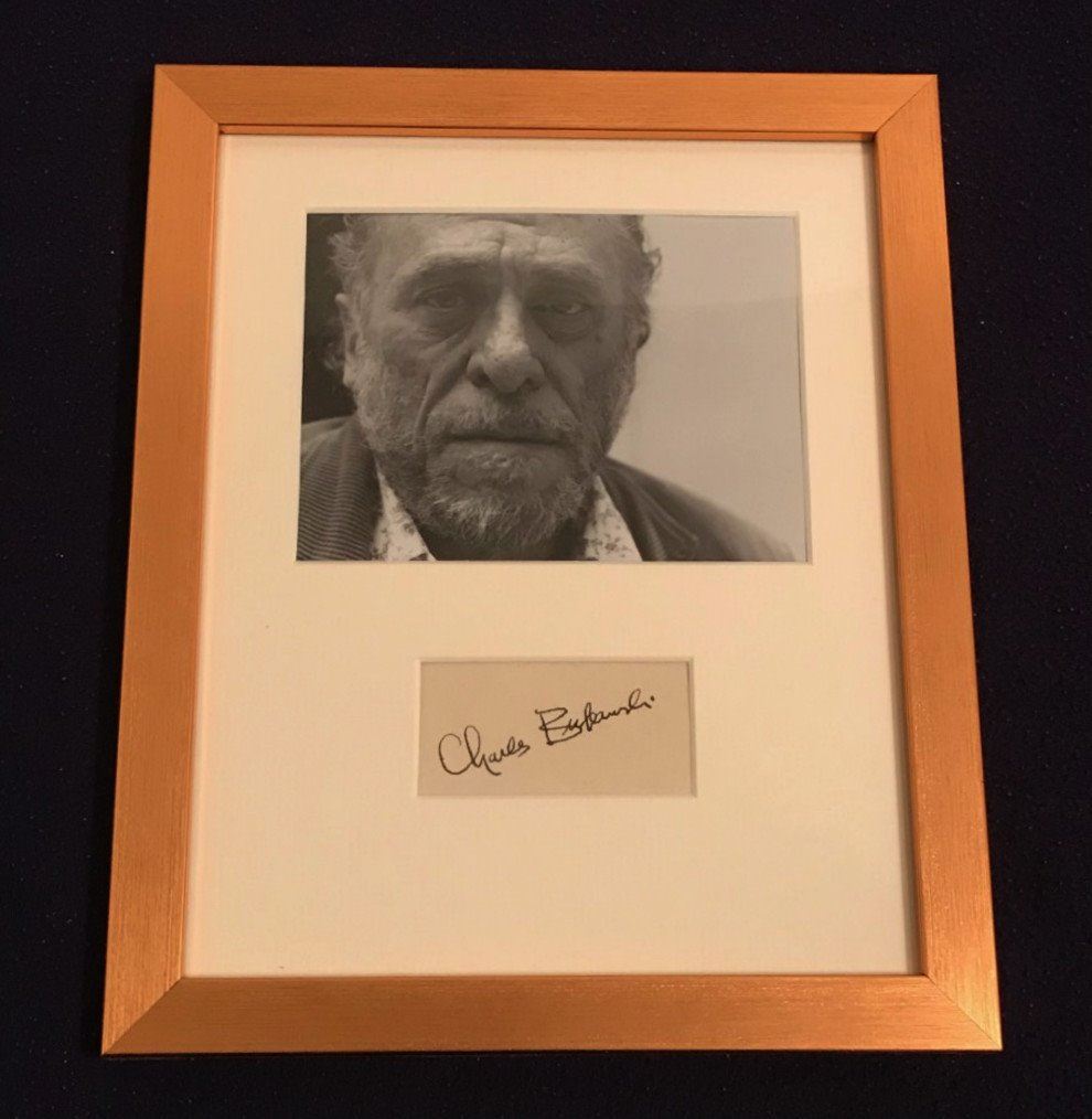 CHARLES BUKOWSKI SIGNED. (1920-1994). Autograph professionally framed.