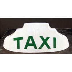 Taxi-Topper sign from top of a taxi-cab