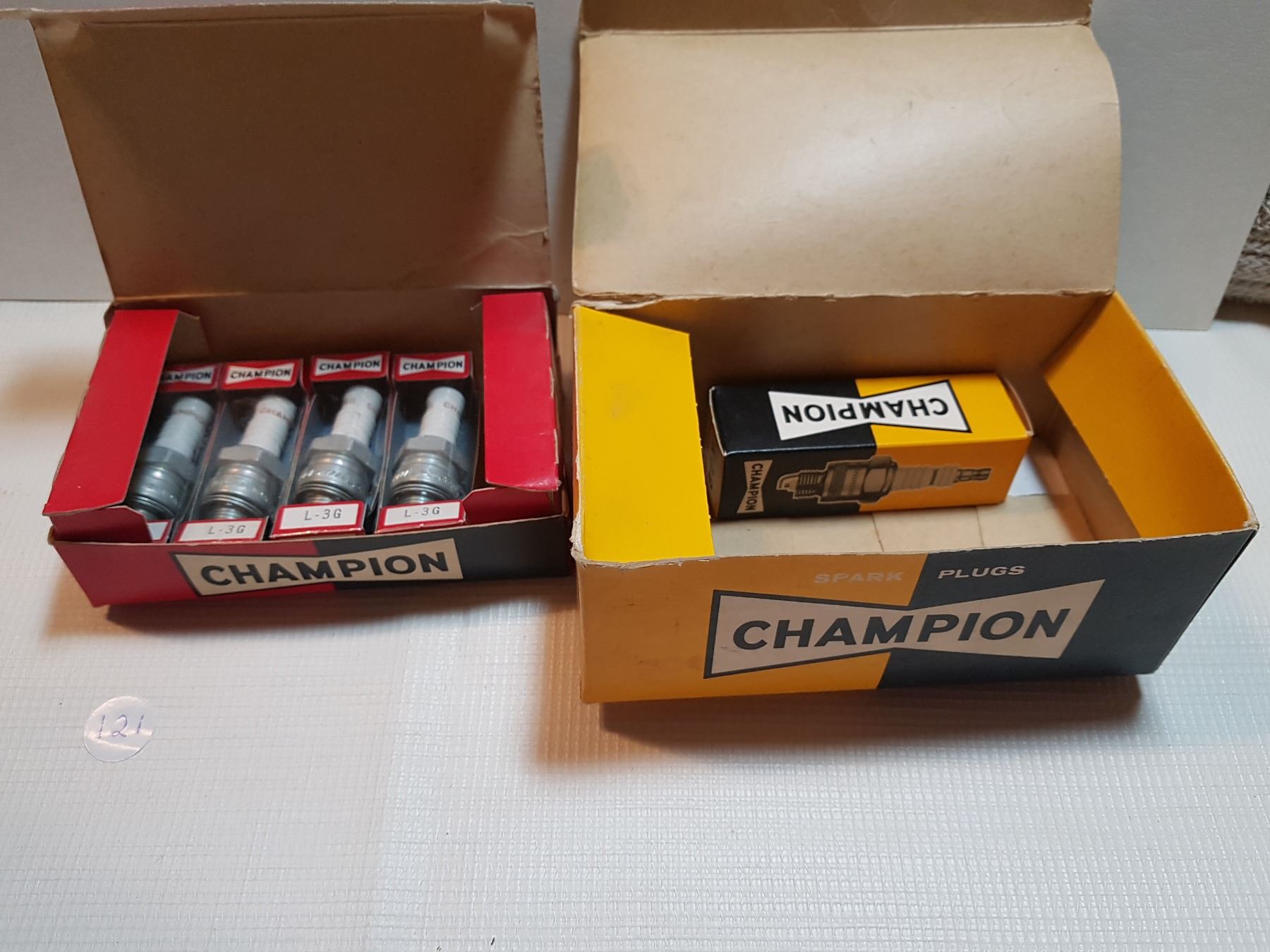 3 GENERATION CHAMPION SPARK PLUG BOXES WITH SOME PLUGS