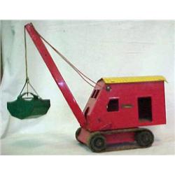 Metal structo crane with a clam bucket