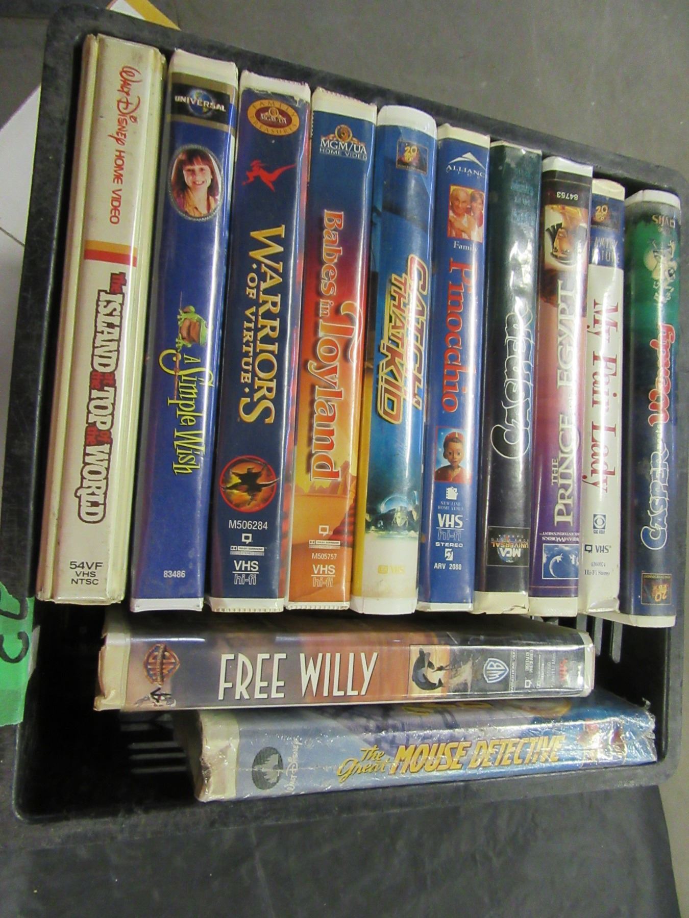 UNCLAIMED STORAGE - CRATE WITH ASSORTED DISNEY VHS TAPES (APPROX. 24)