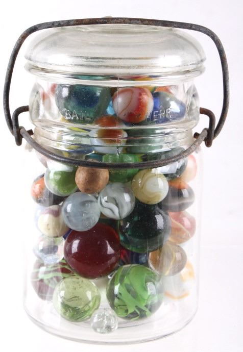 Collection of Various Sized Marbles In Mason Jars