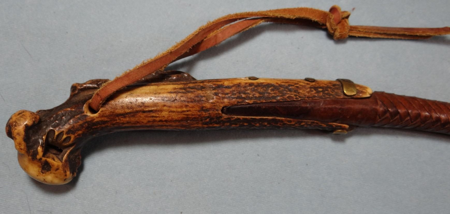 Fancy braided leather quirt with bone handle and 40' rawhide riata