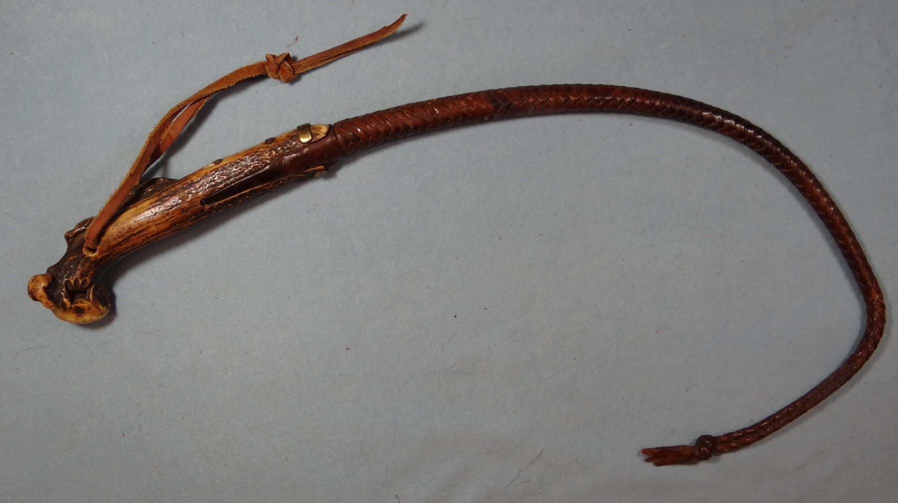 Fancy braided leather quirt with bone handle and 40' rawhide riata
