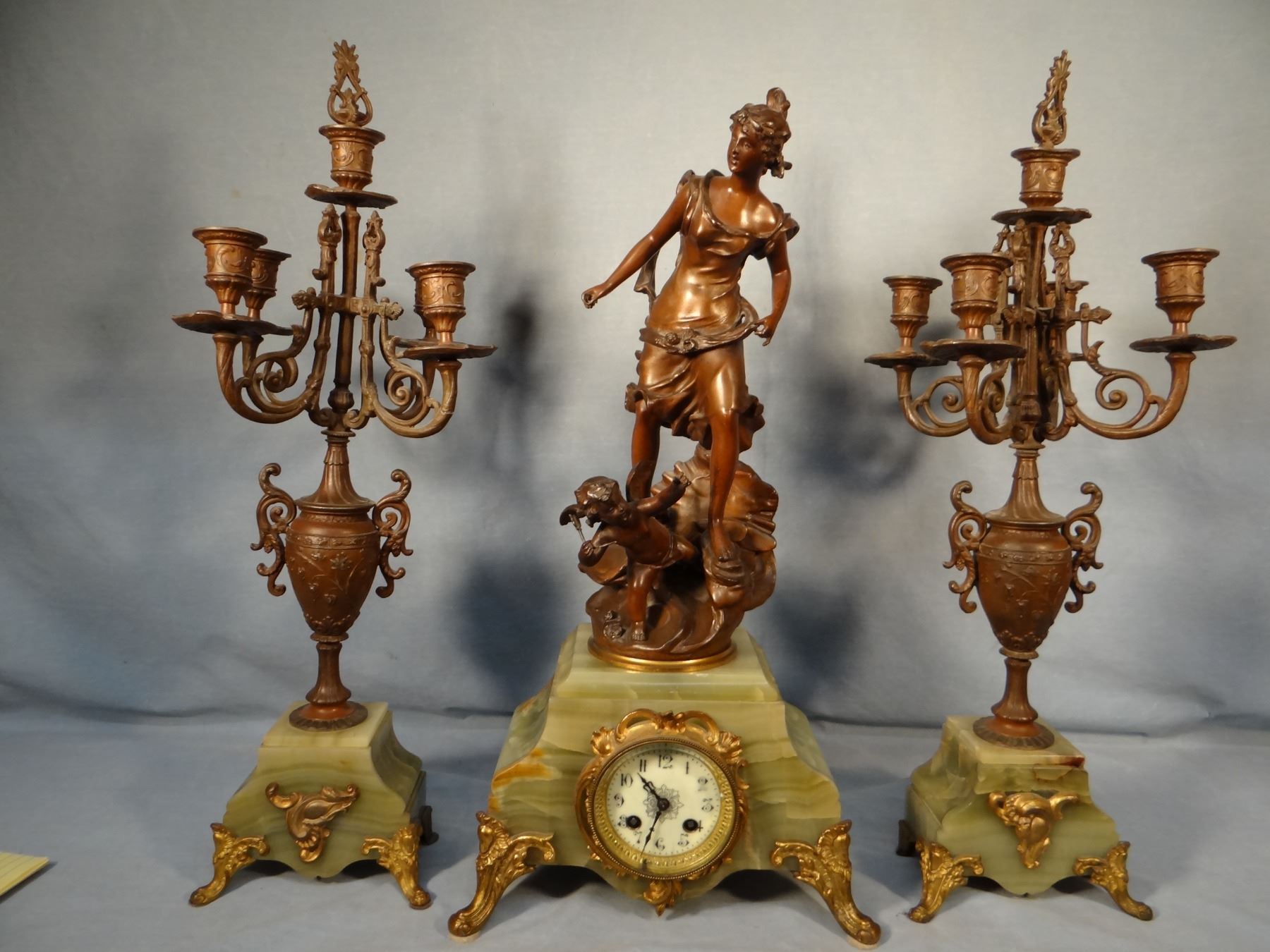 I Rousseau French ornate figural clock w/cupid and arrow, jadite base ...