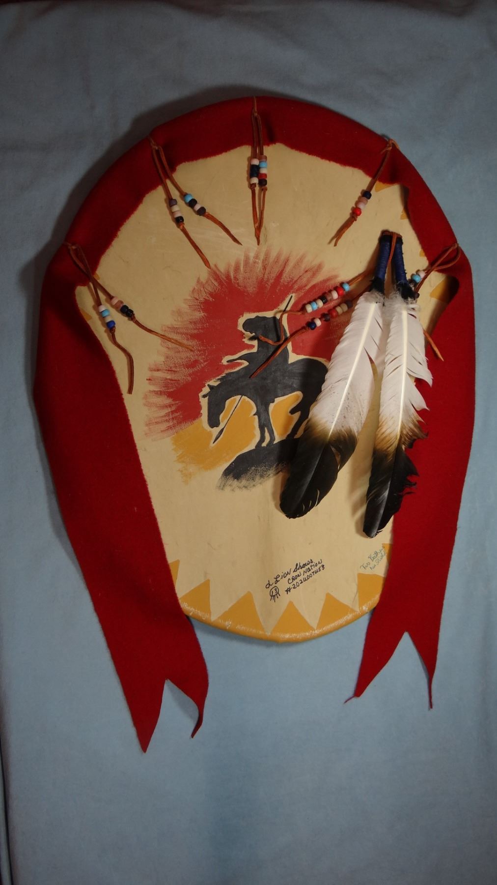 Crow rawhide shield, I. Lion Shows, 30" w