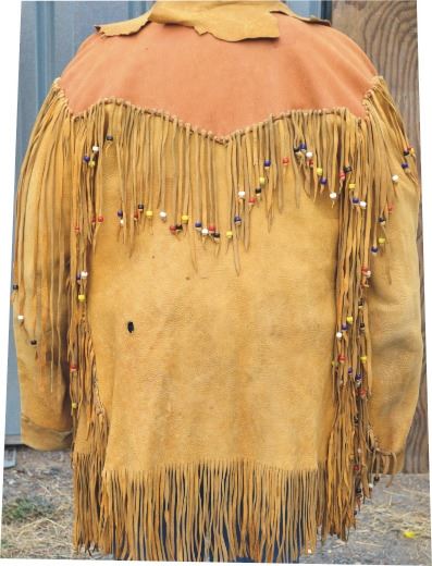 vintage fringed and beaded men’s deer hide coat