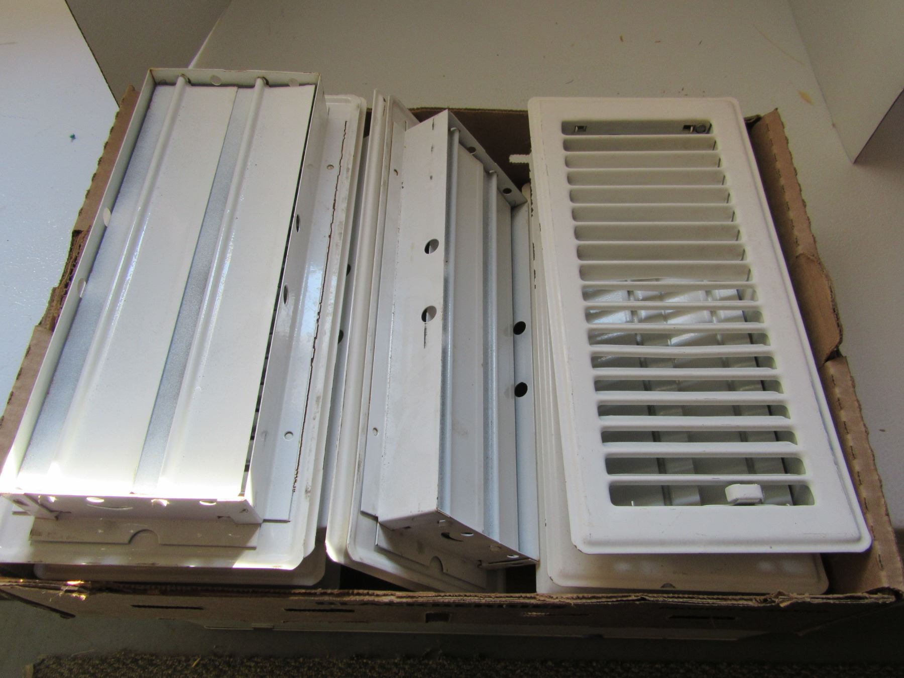 BOX WITH NINE WHITE (11" X 9") HEAT REGISTERS