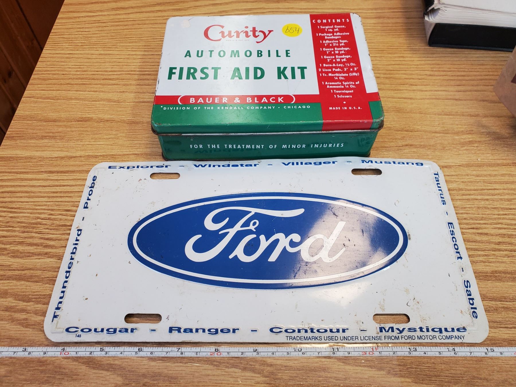 VINTAGE FORD LICENSE PLATE & FIRST AID KIT - Schmalz Auctions