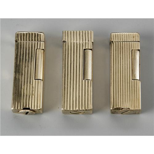 THREE 14K GOLD DUNHILL LIGHTERS THREE 14K GOLD DUNHILL LIGHTERS