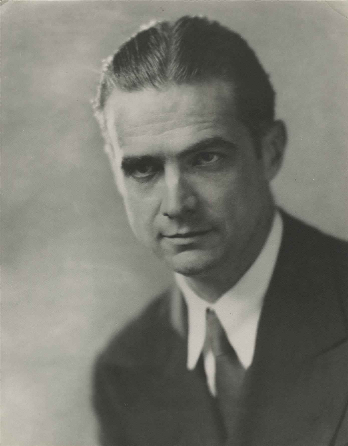 Howard Hughes personal oversize head-and-shoulders portrait photograph.