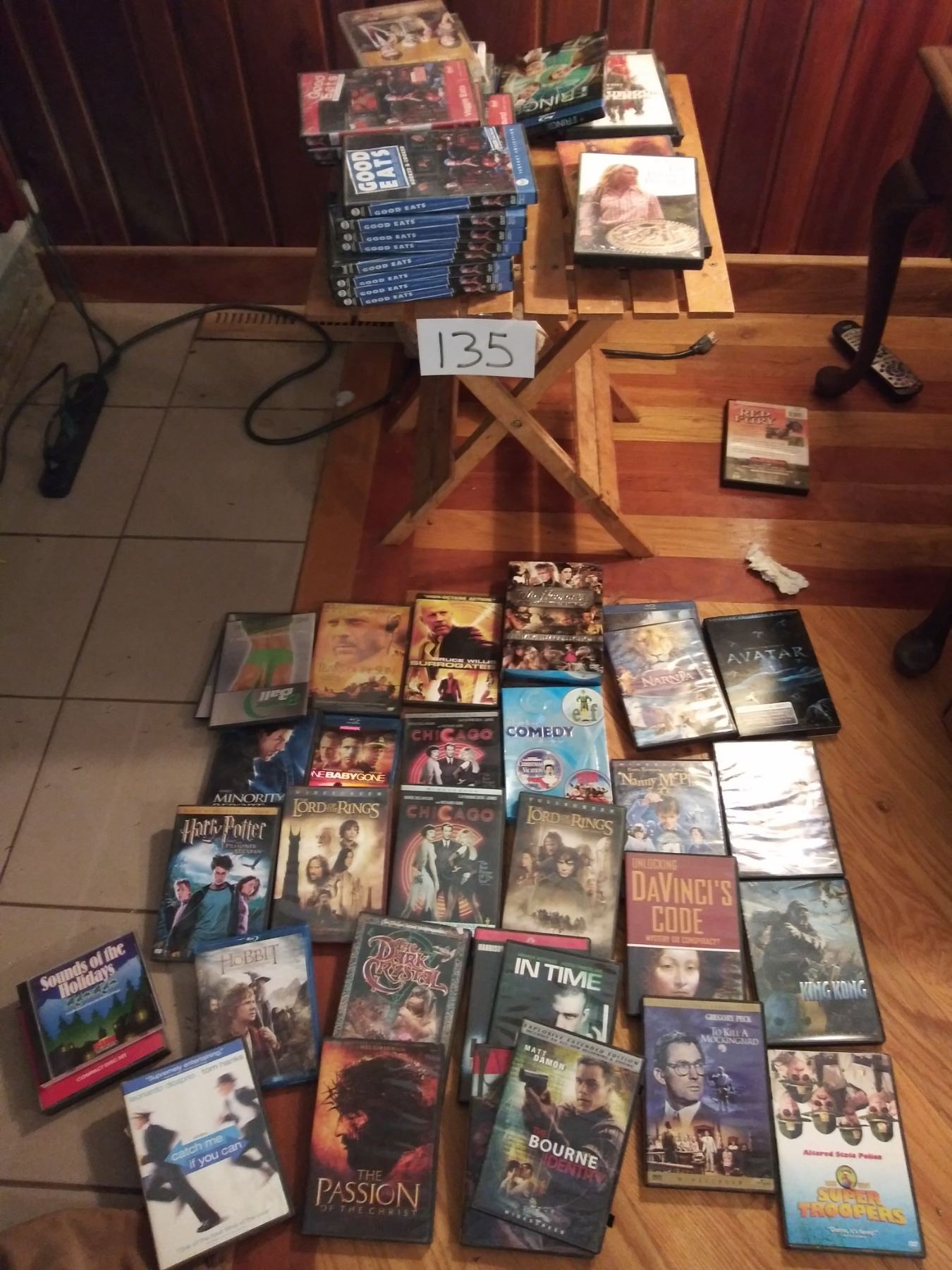 Folding Stand with approx 50 DVD's table 20"l x 18"w x 20"lt