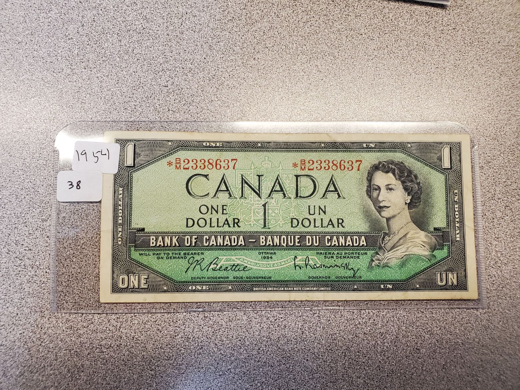 1954 BANK OF CANADA ONE DOLLAR BILL Schmalz Auctions 1954-bank-of-canada-one-dollar-bill-schmalz-auctions