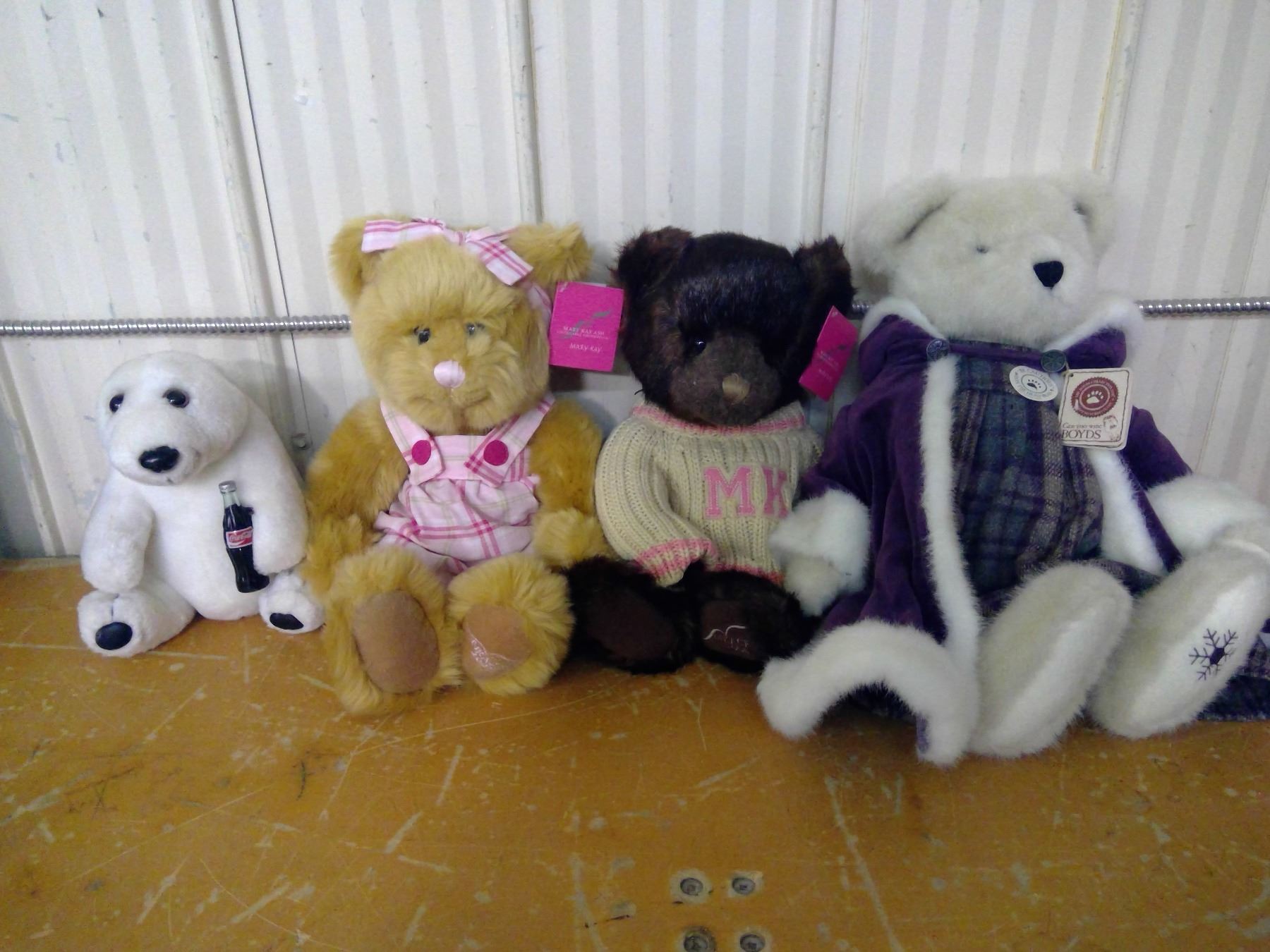 two mary kay bears, one coca cola bear, and one winter teddy bear ...