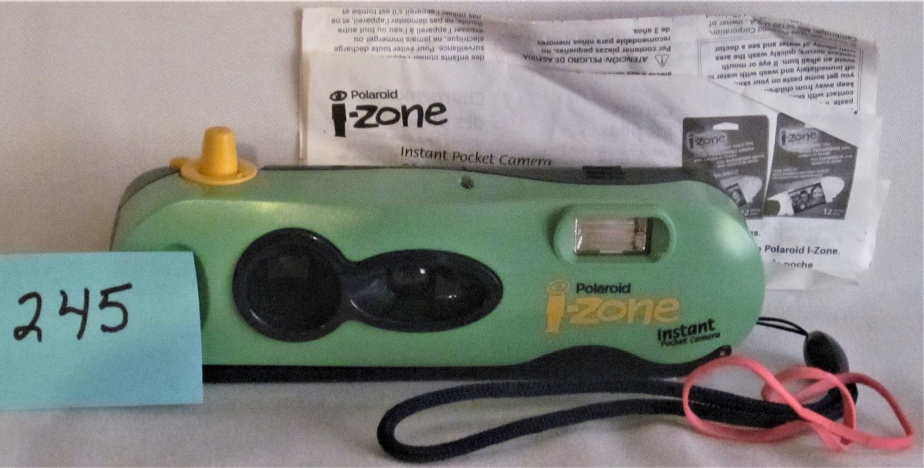 POLAROID "IZONE" INSTANT POCKET CAMERA W/ INSTRUCTIONS - Schmalz Auctions