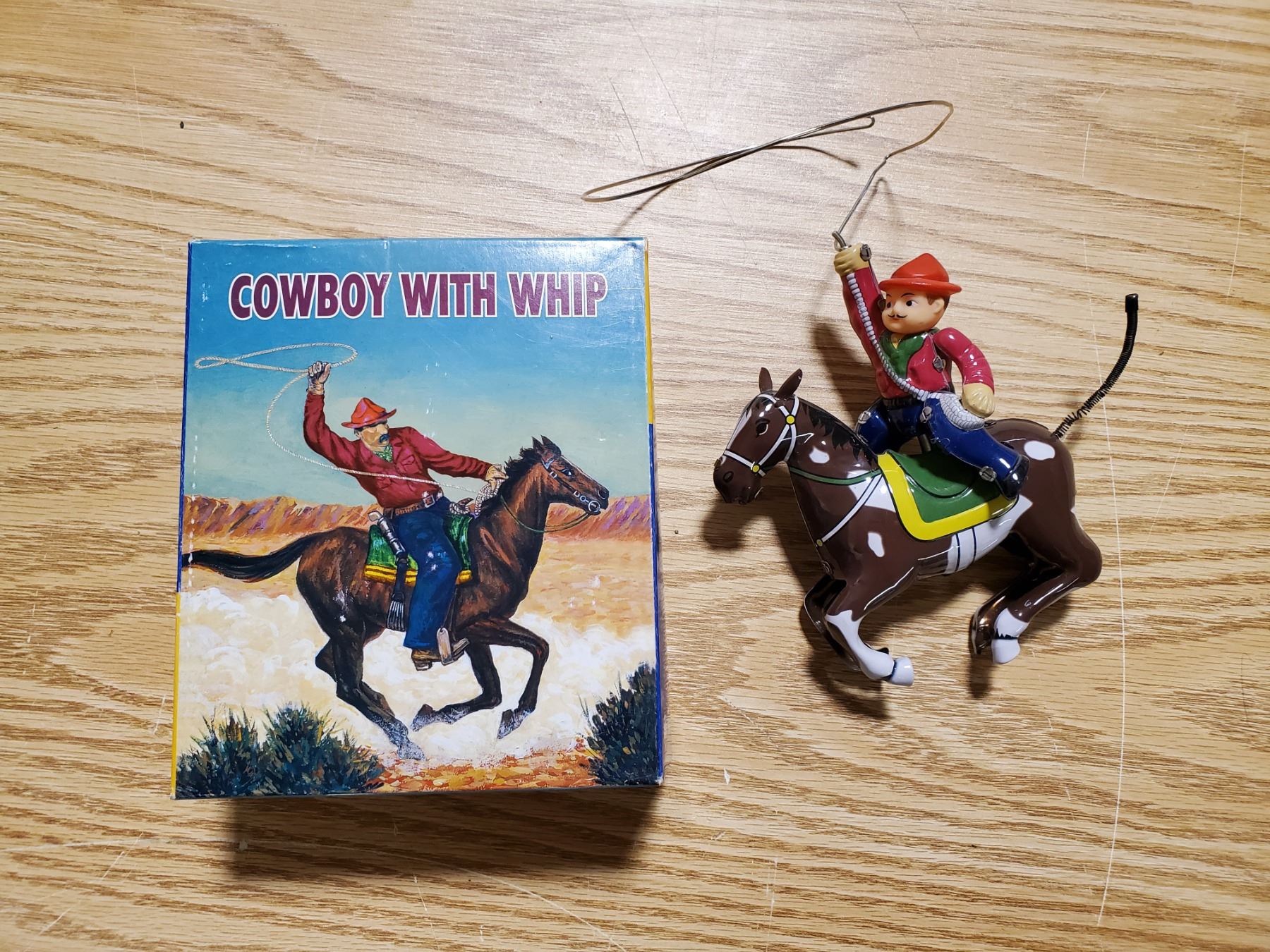 wind up cowboy with lasso (in original box) - Schmalz Auctions