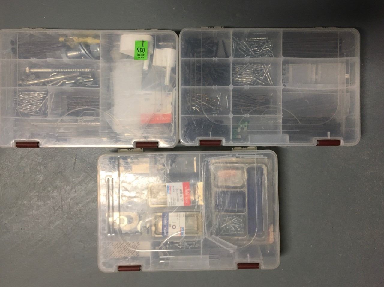 Three partitioned Organizer Plano bins full of nails etc
