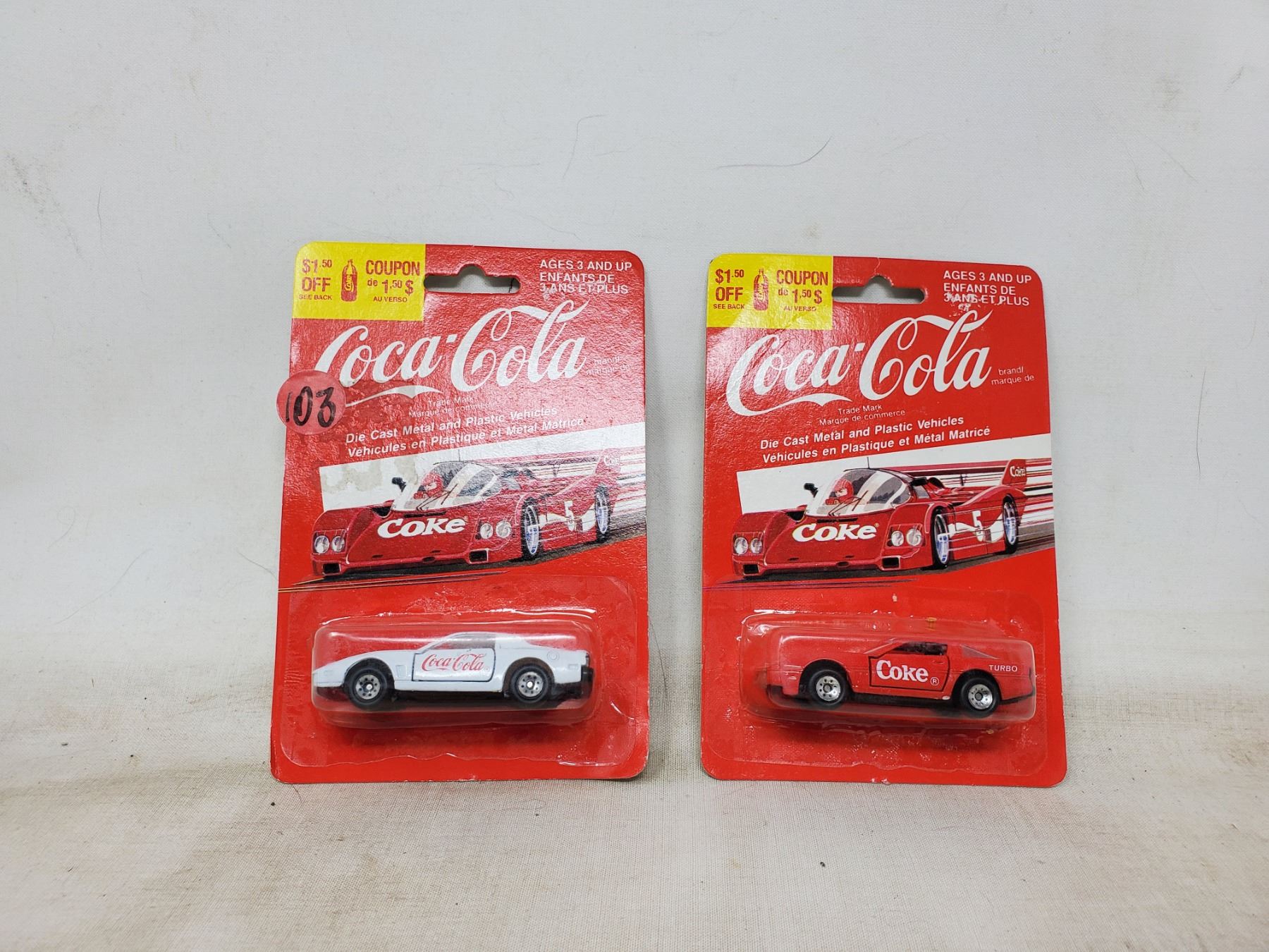 Pair of die cast Coca Cola toy cars