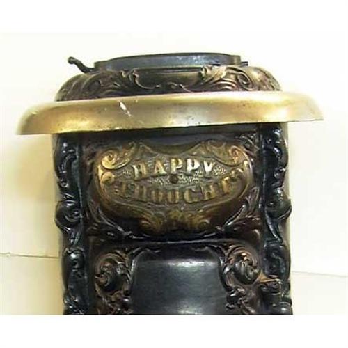 CAST IRON STOVE: Pot bellied coal parlor stove inscribed ''HAPPY THOUGHT''.