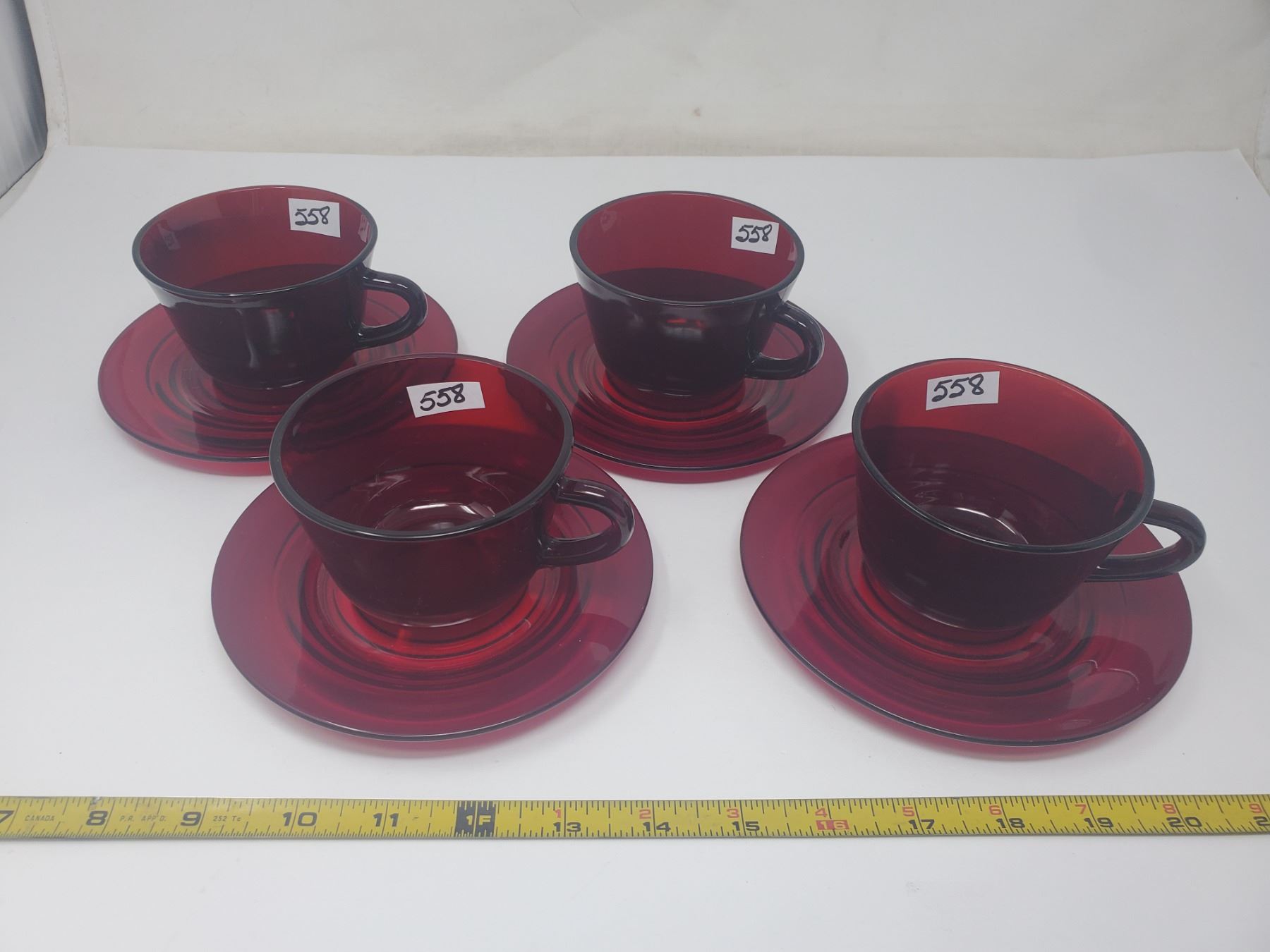 4 ruby glass cups & saucers (depression glass)