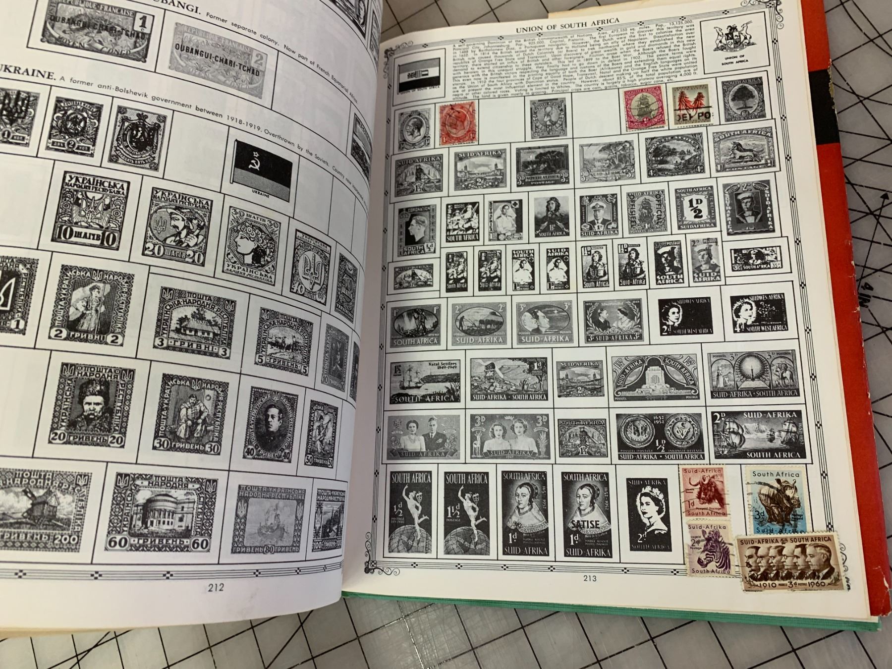 PREMIER WORLD STAMP ALBUM BOOK WITH MANY STAMPS - Schmalz Auctions