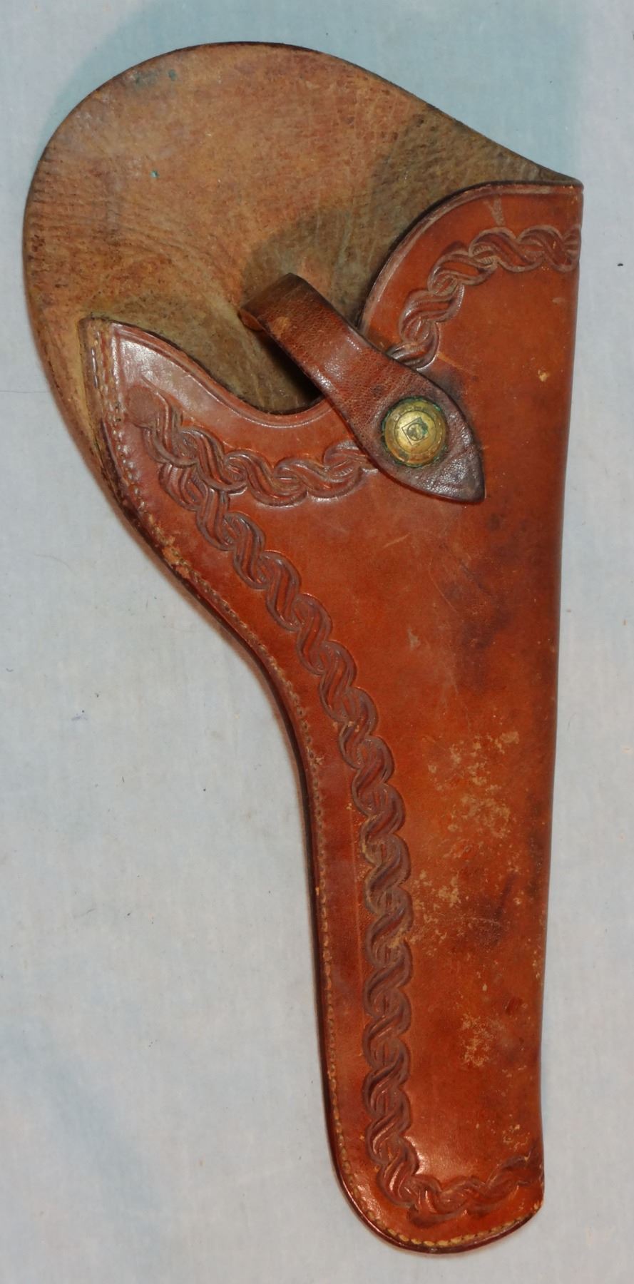 George Lawrence flap holster and Buffalo Bill tooled holster w ...