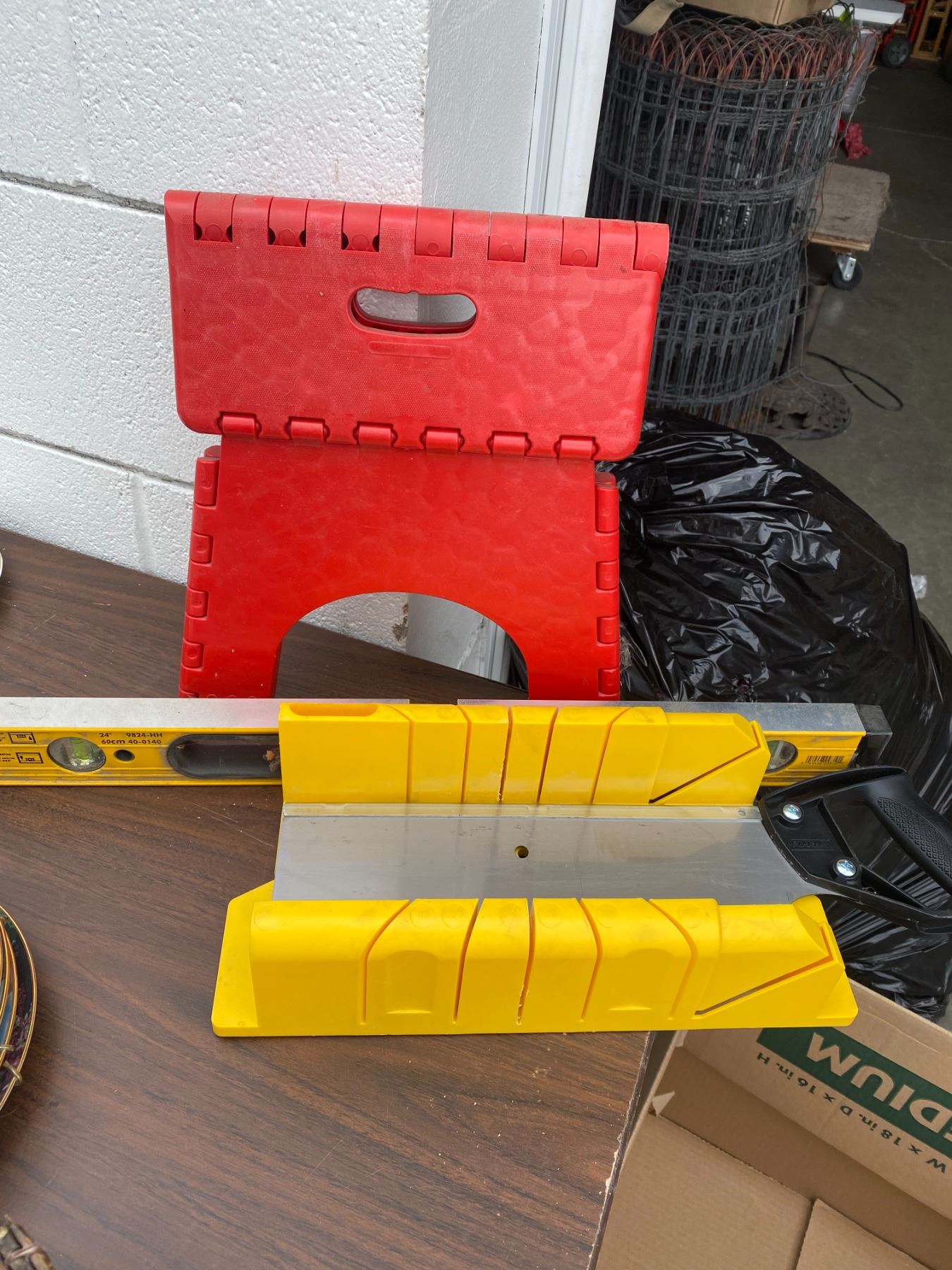 Level, saw and stool