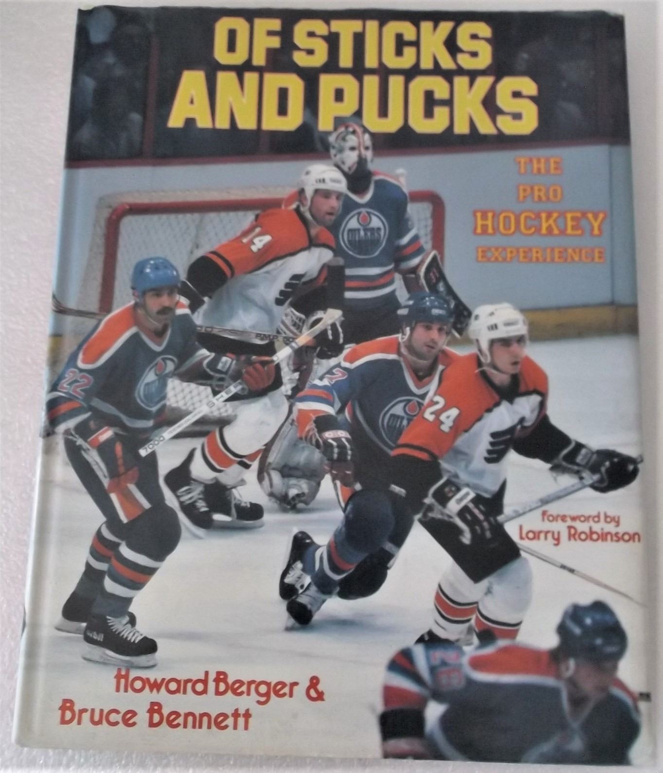 Of Sticks and Pucks by Howard Berger & Bruce Bennett