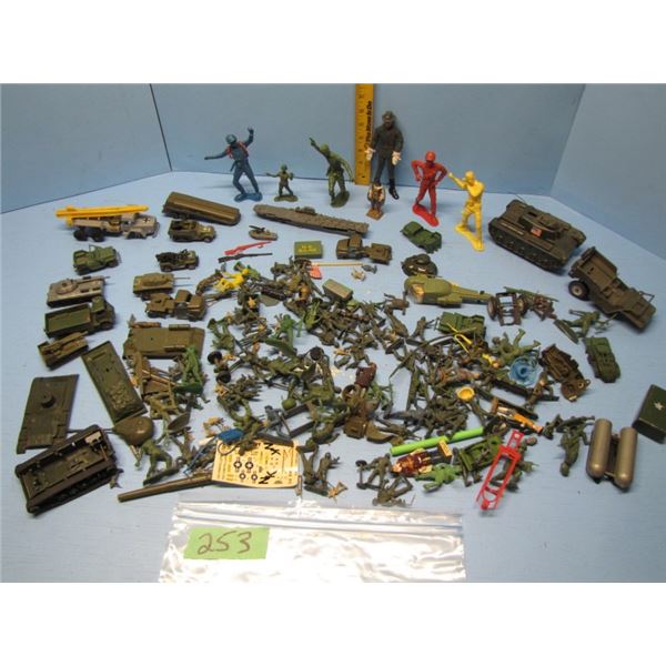 collection of plastic army men tanks trucks etcetera