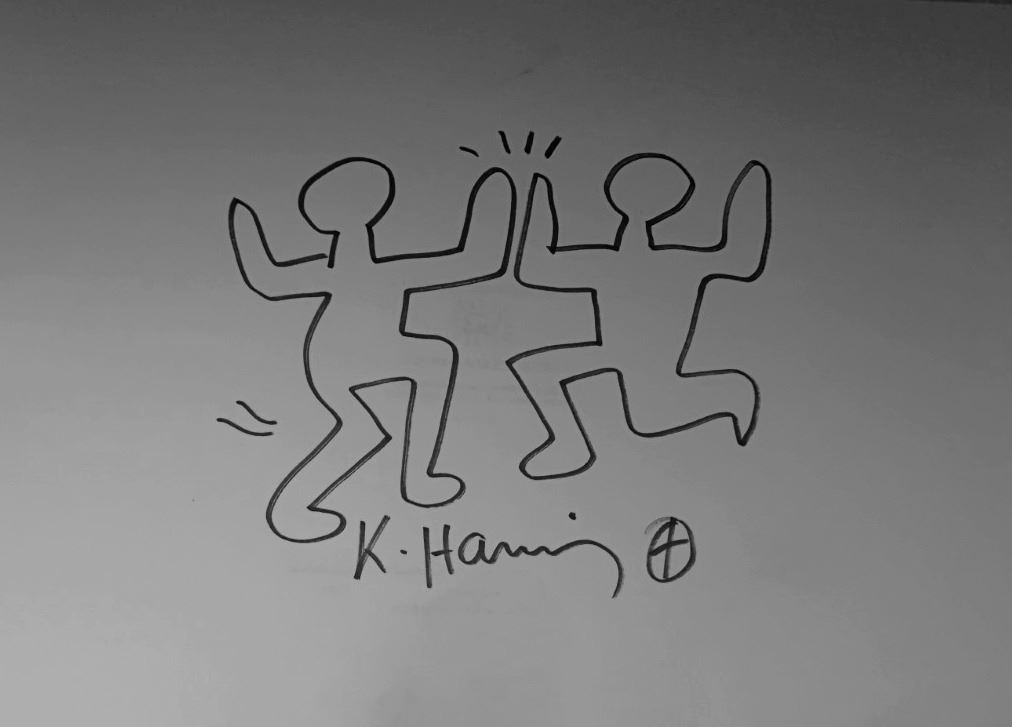 Keith Haring drawing of dancing men.