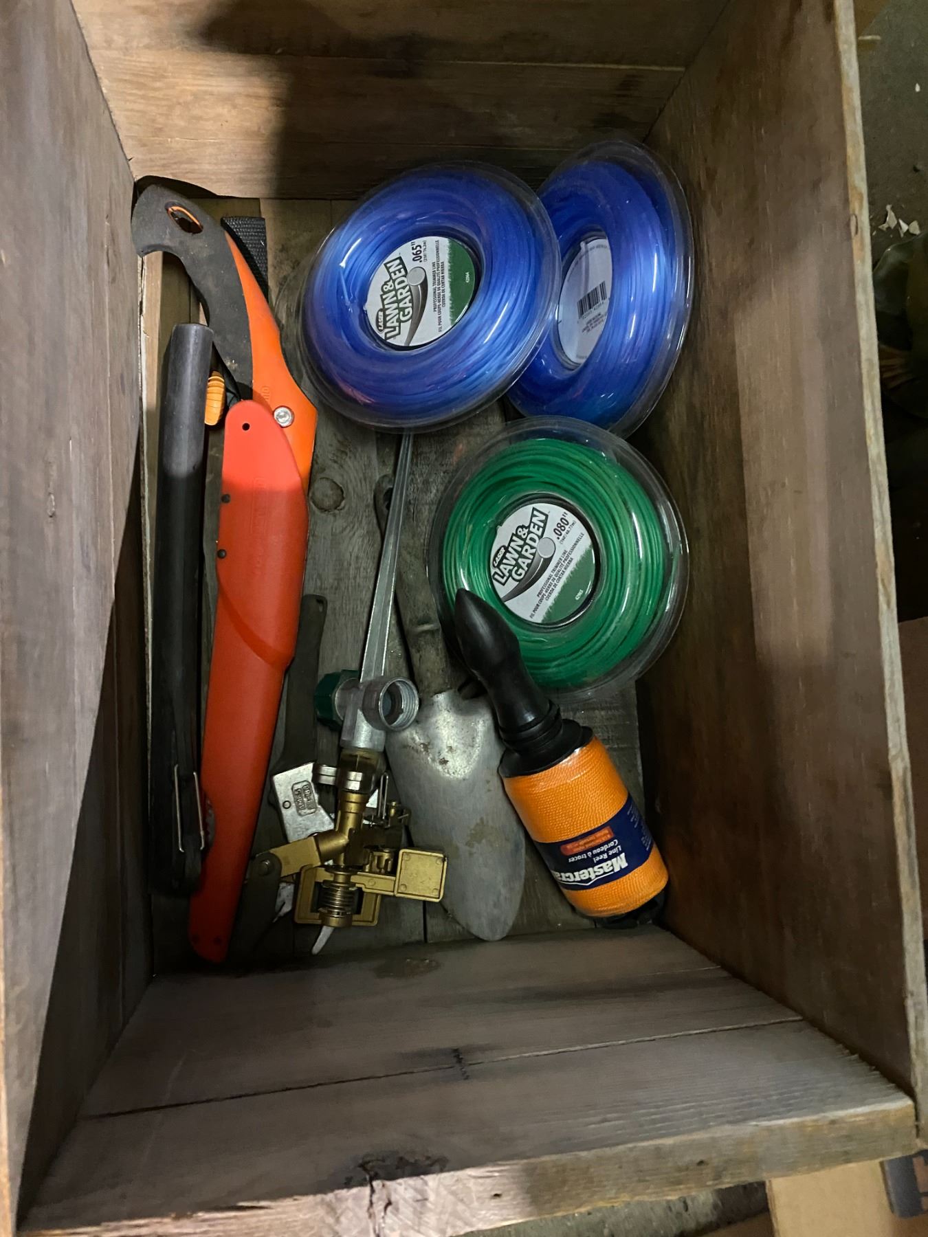 Weed eater line sprinkler and wood box
