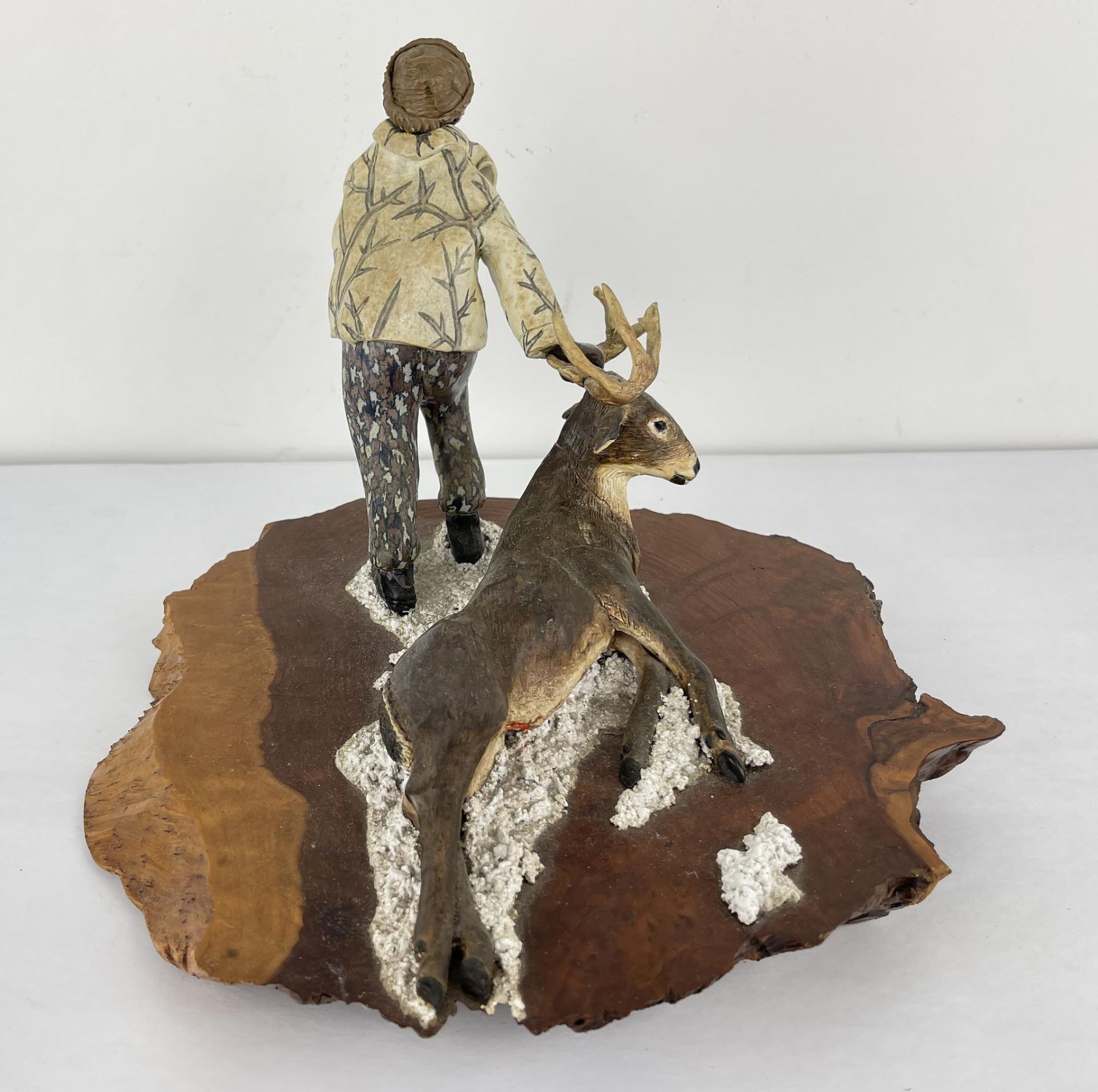 Sculpture of Gene Wensel Dragging His Deer