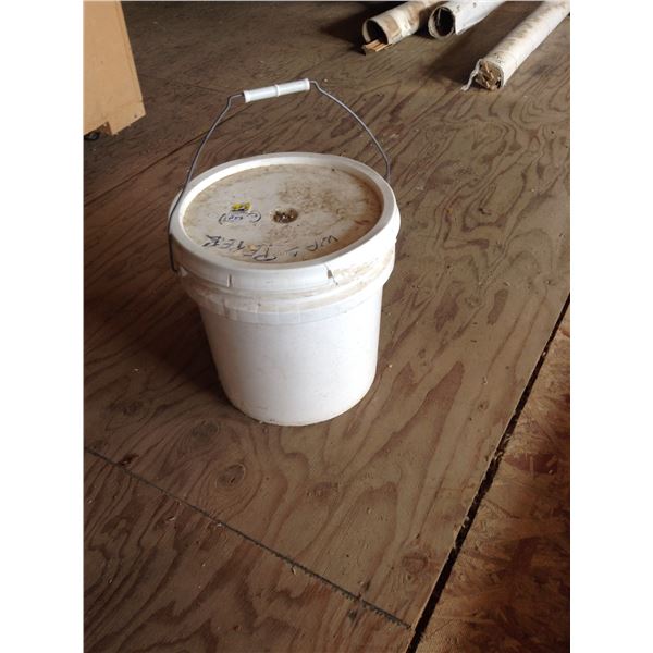 Bucket of glue for wallpaper