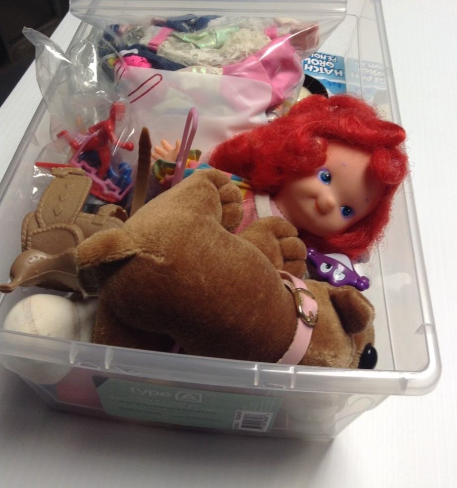 Shoebox Bin of Toys , including Barbie Clothes and Hatch & Grow Penguin