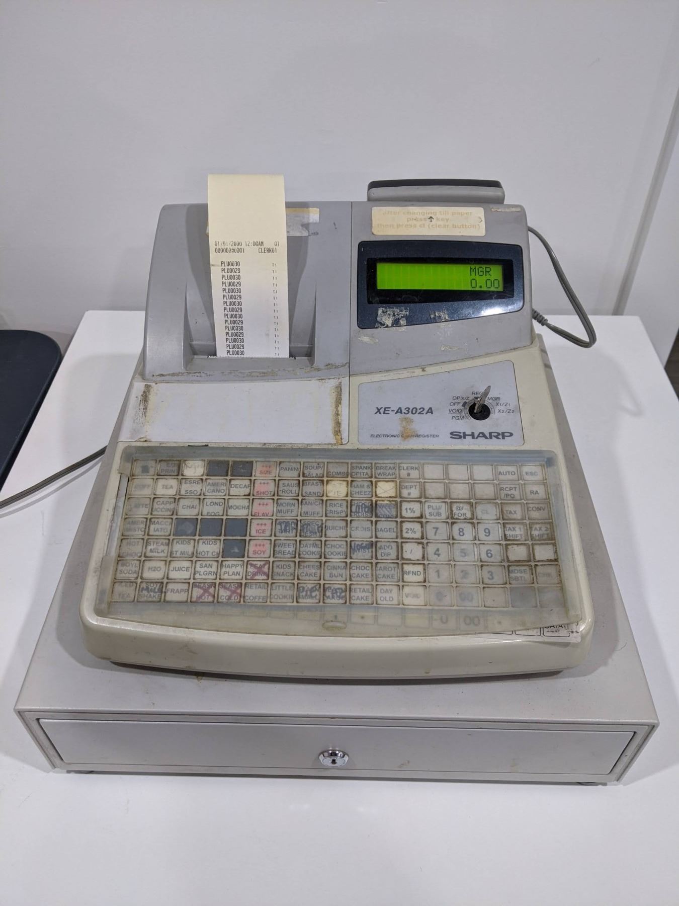 Sharp Cash Register - Model no. XE-A302A - turns on