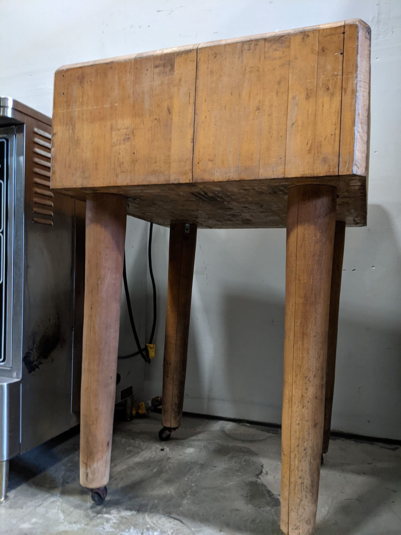 Butcher block meat cutting table w/ wheels - approx. 23" L x 23" W x 36" H