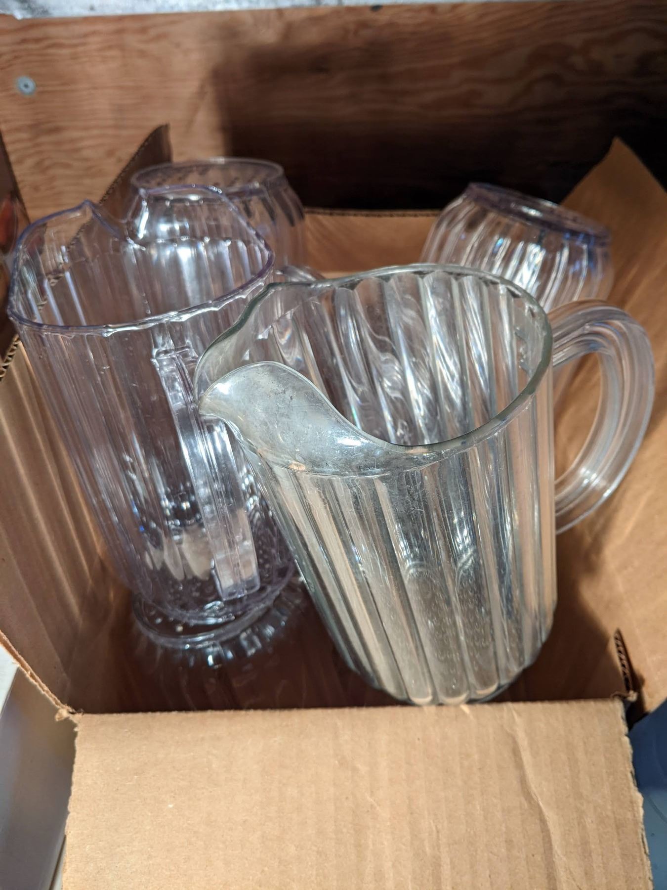 Box full of plastic Pitcher Jugs (9 pcs)