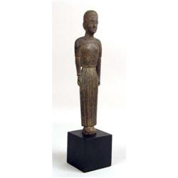 A CARVED STONE KORE-STYLE FEMALE FIGURE