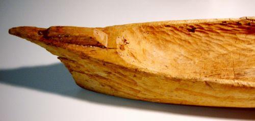 A SUPERB AND RARE TORRES STRAIT DUGOUT CANOE,