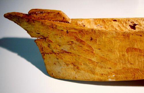 A SUPERB AND RARE TORRES STRAIT DUGOUT CANOE,