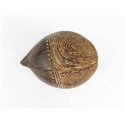 A MARAPAI RATTLE, of coconut shell incised wi
