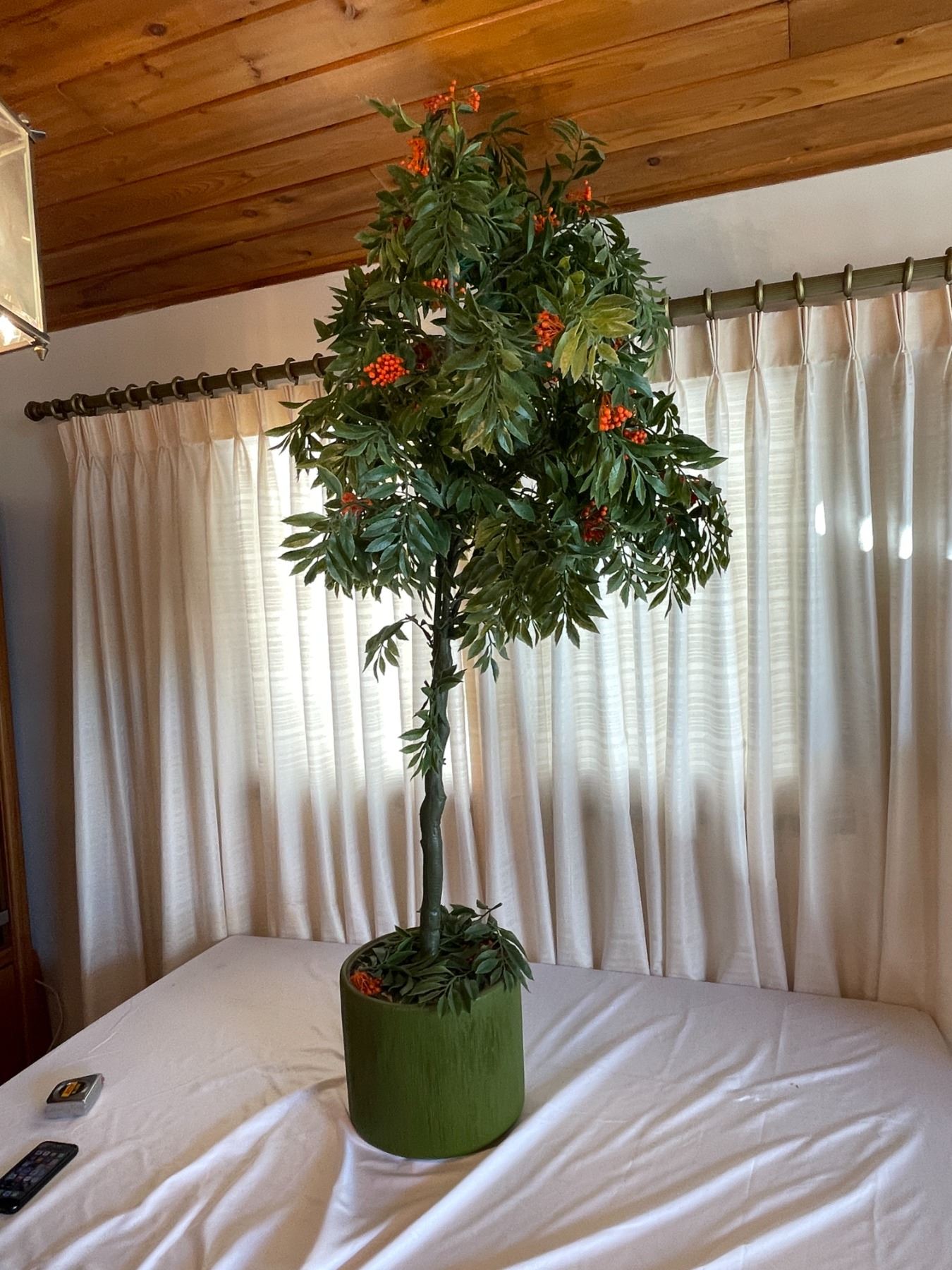 Large artificial tree in planter