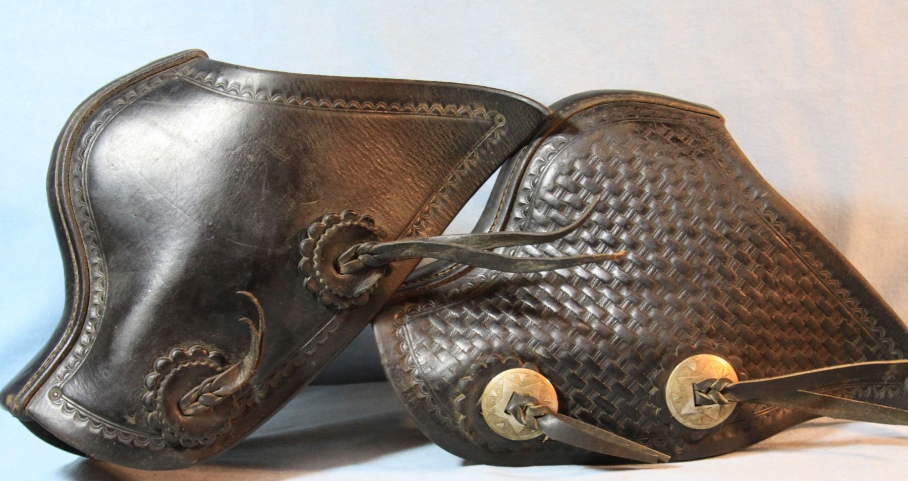 Dark leather tapaderos, basket stamped, unmarked