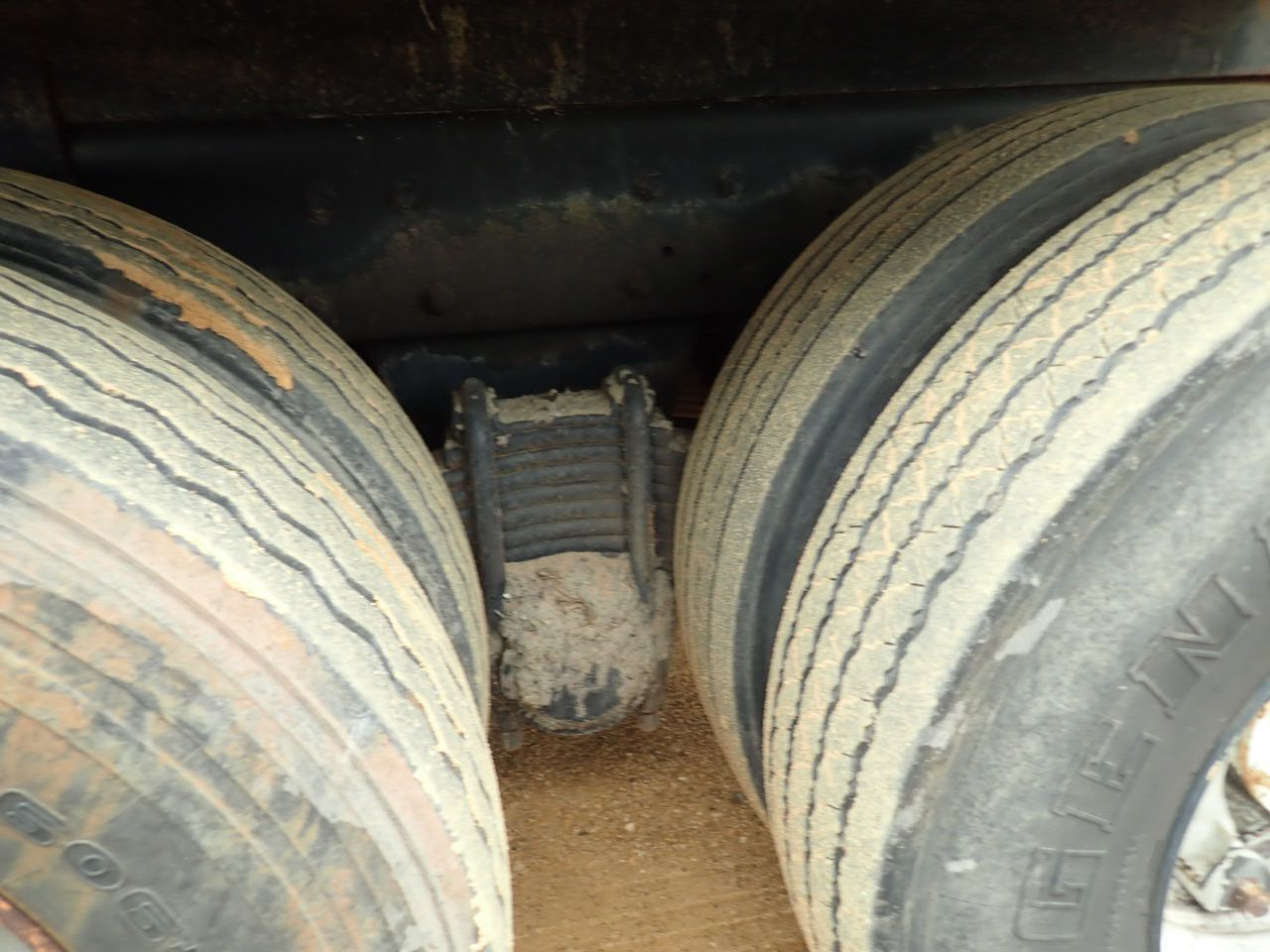 1996 MACK DM690S Grapple Truck - J.M. Wood Auction Company, Inc.